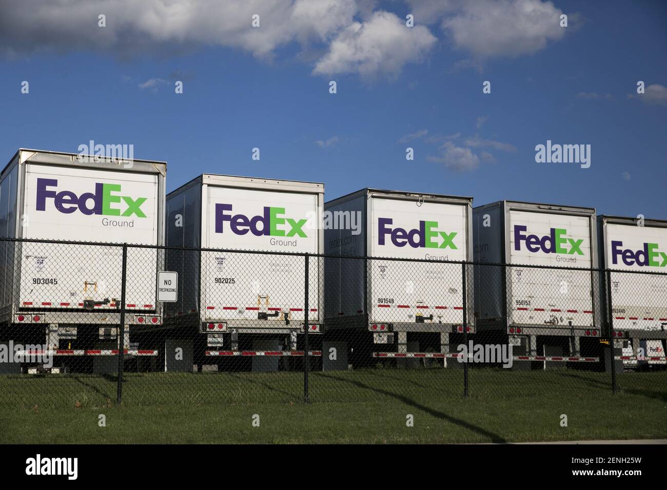 FedEx Ground logos on truck trailers at a FedEx distribution center in ...