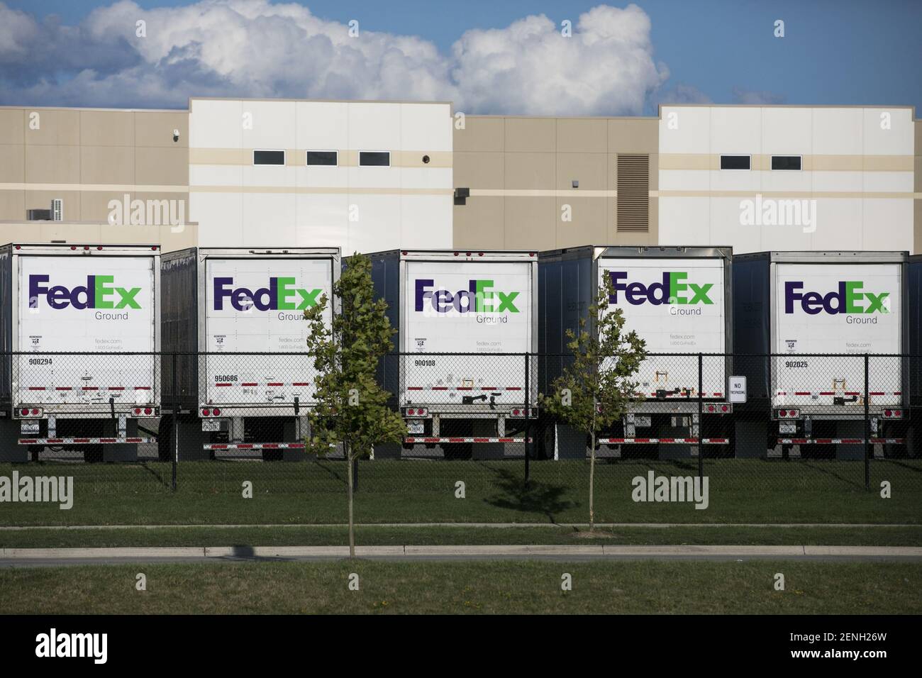 FedEx Ground logos on truck trailers at a FedEx distribution center in ...