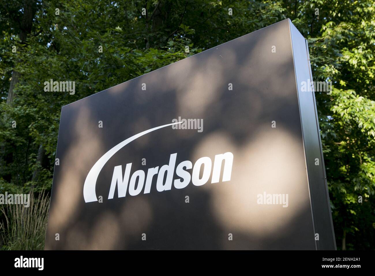 A logo sign outside of the headquarters of the Nordson Corporation in ...