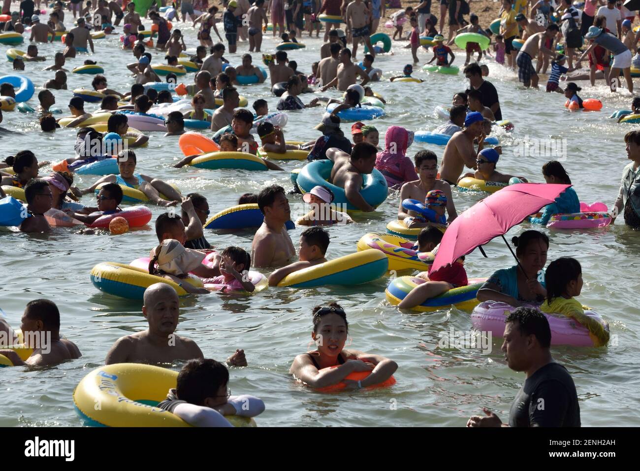 Visitors swarm to the local sea resort after Typhoon Lekima in Dalian ...