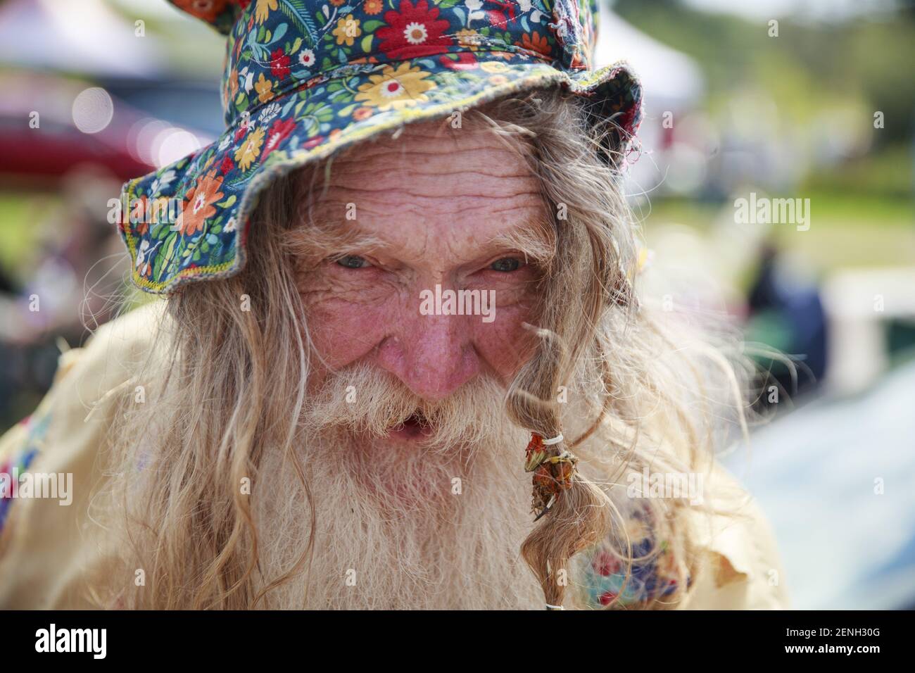 Allyn Richardson, also known as Grandpa Woodstock, poses for a photo at ...