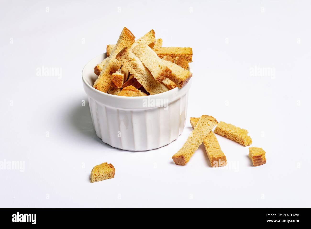 Homemade croutons in bowl isolated on white background. Crispy food ...