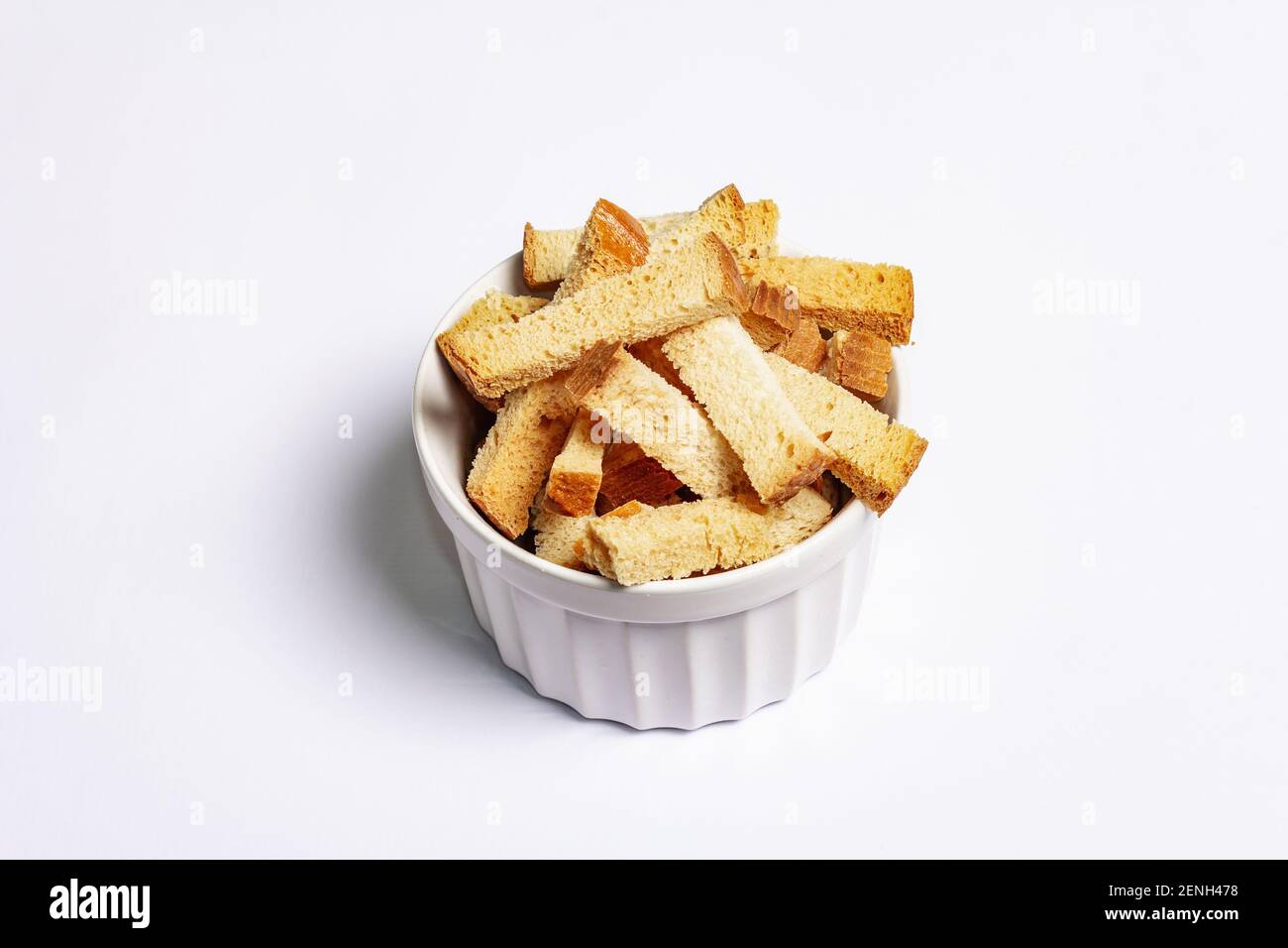 Homemade croutons in bowl isolated on white background. Crispy food ...