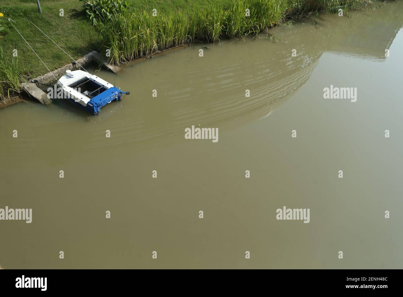 A remote-controlled unmanned vessel able to collect garbage from water ...
