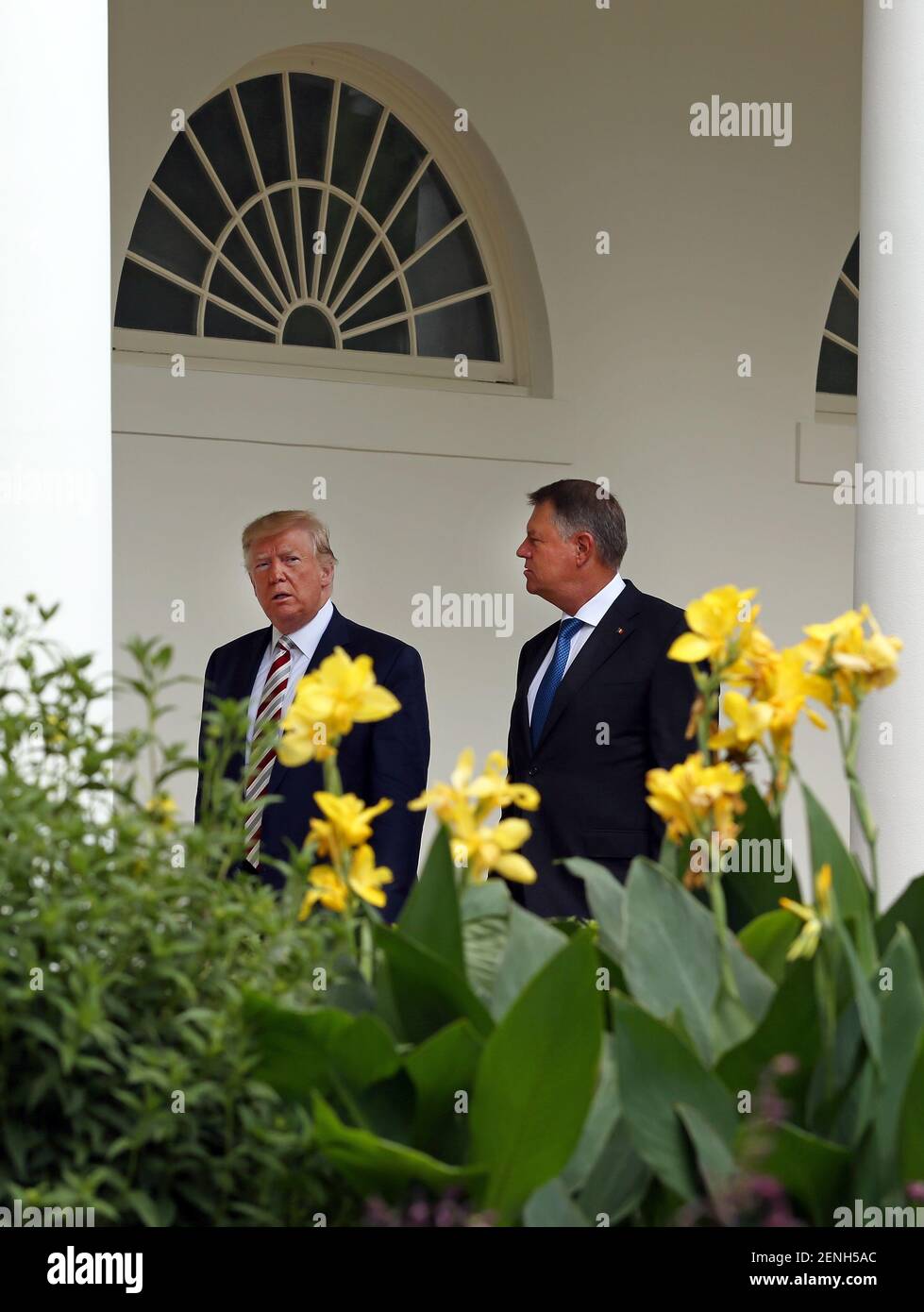 President Donald J. Trump walks with President Klaus Iohannis of ...