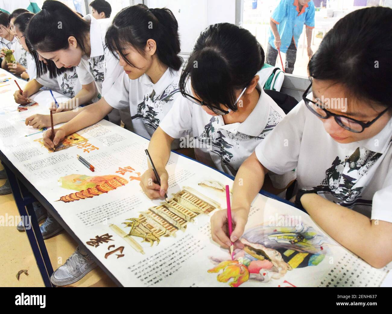 Students design and draw during Chinese self-designed newspaper ...
