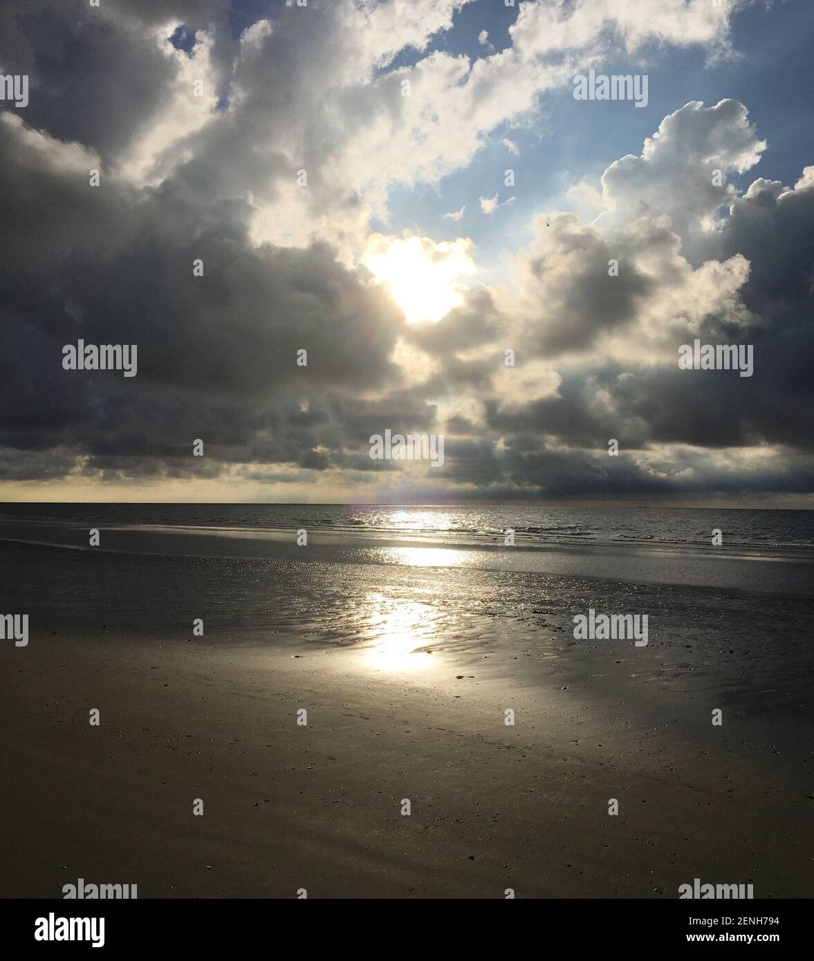 Beach sunset with clouds hi-res stock photography and images - Alamy