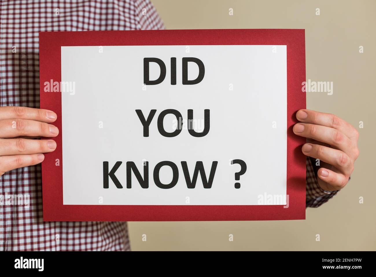 Image of man holding paper with text did you know Stock Photo - Alamy