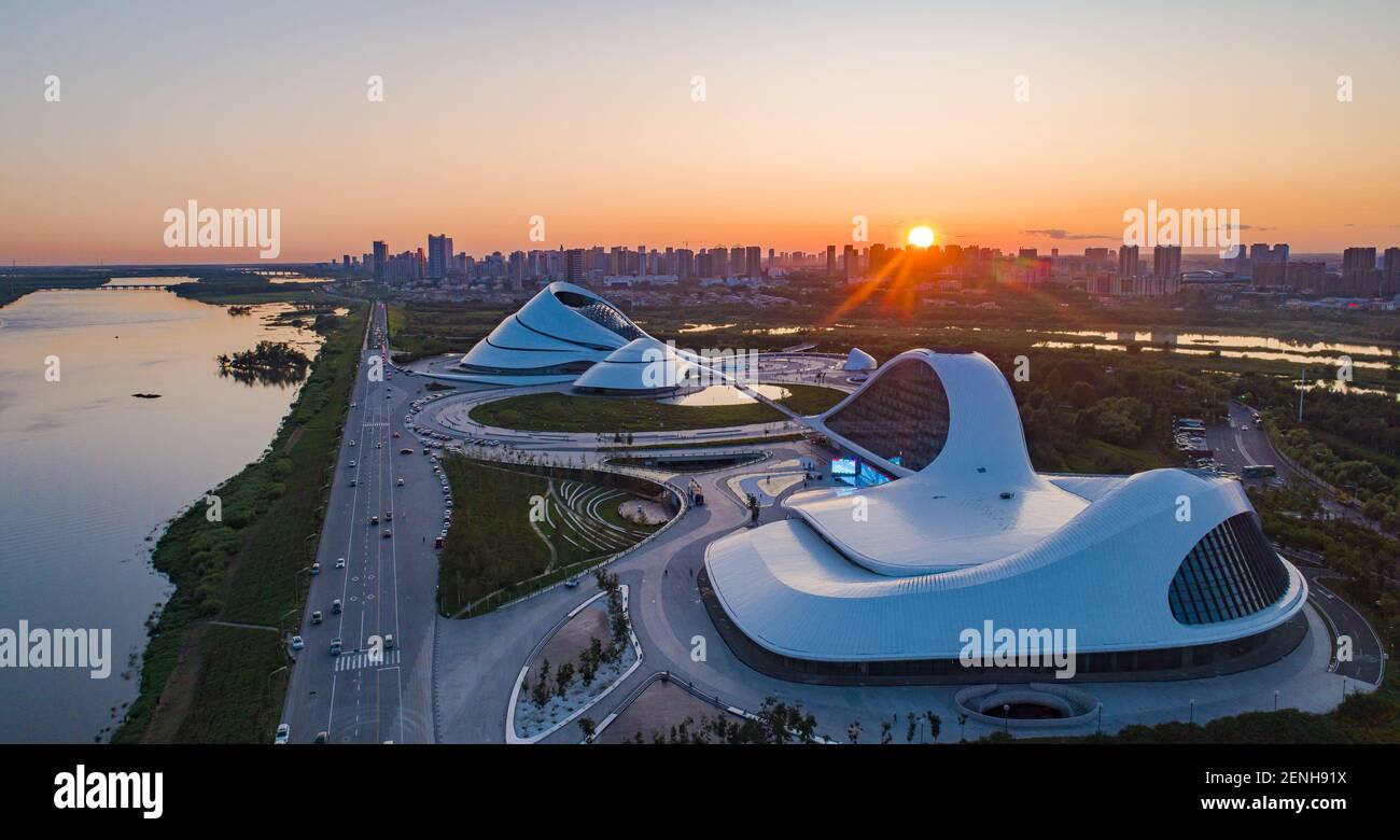 An aerial view at sunset of Harbin Opera House or Harbin Grand Theater ...