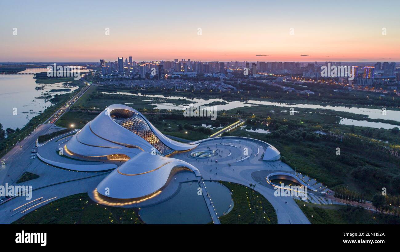 An aerial view at sunset of Harbin Opera House or Harbin Grand Theater ...