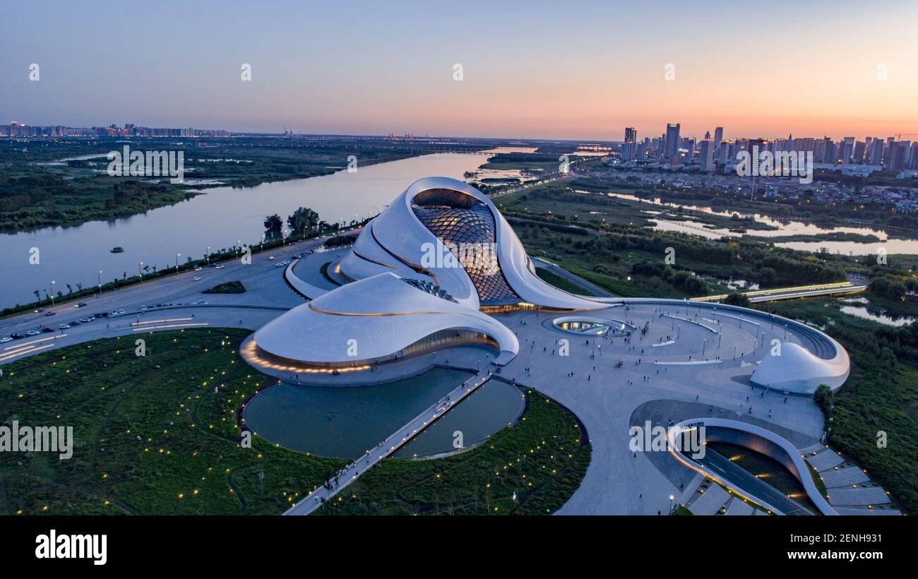 An aerial view at sunset of Harbin Opera House or Harbin Grand Theater ...