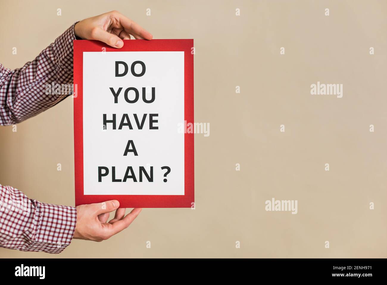 Image of man holding paper with text do you have a plan Stock Photo - Alamy