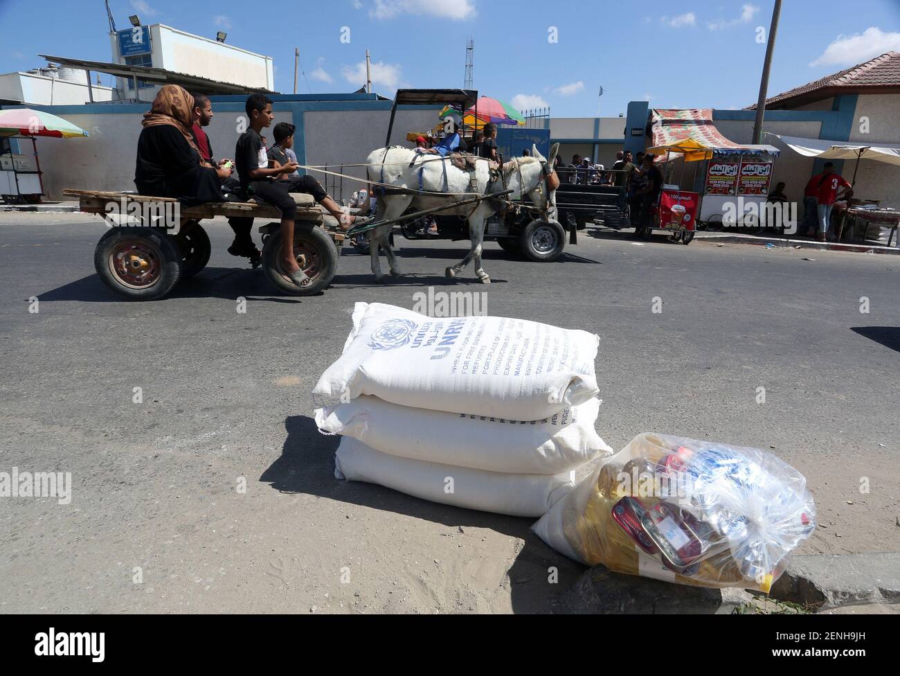 Palestinians receive their monthly food an aid distribution centre run ...