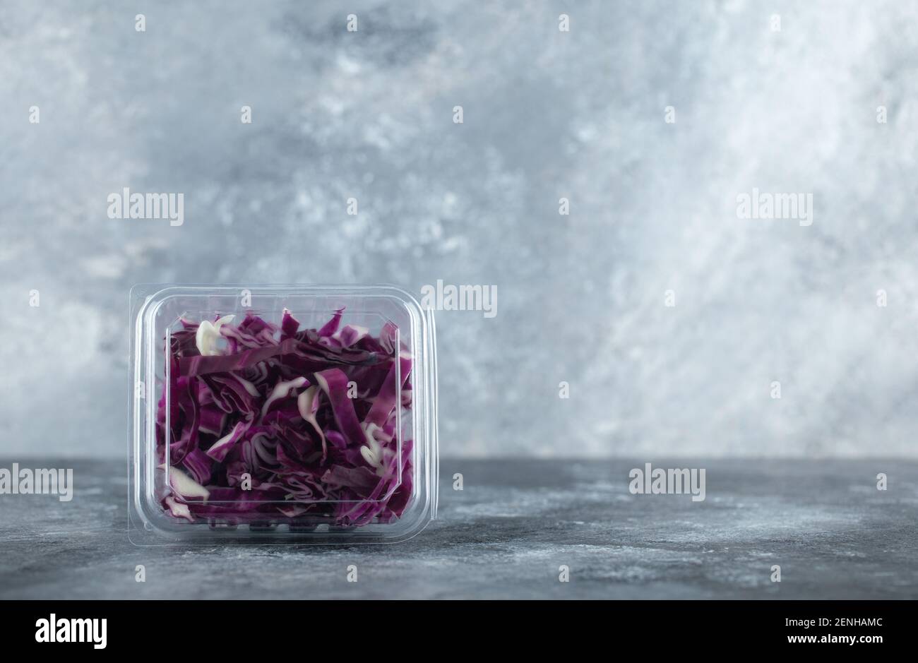 Wide angle photo of plastic container full with chopped purple cabbage ...