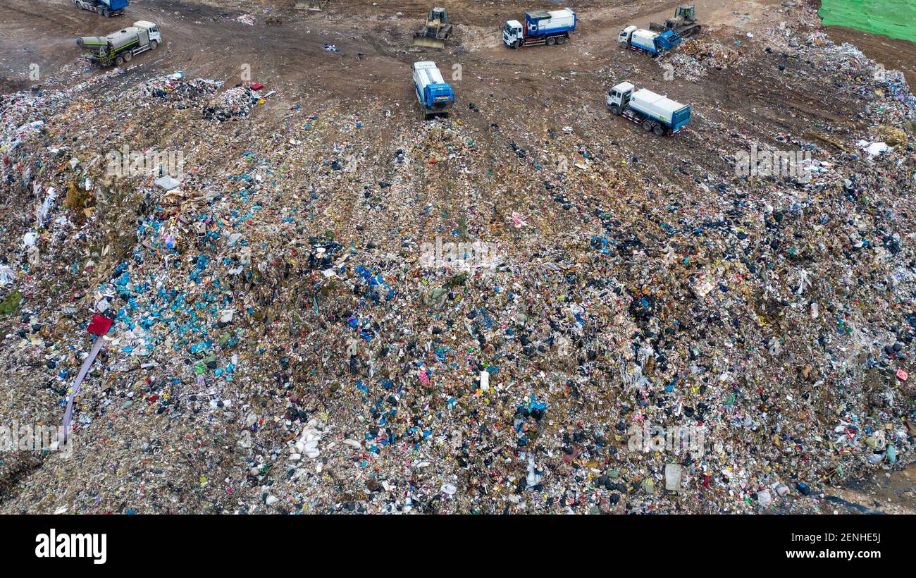 Chinese workers sort out and bury kitchen waste at the Jiangcungou ...