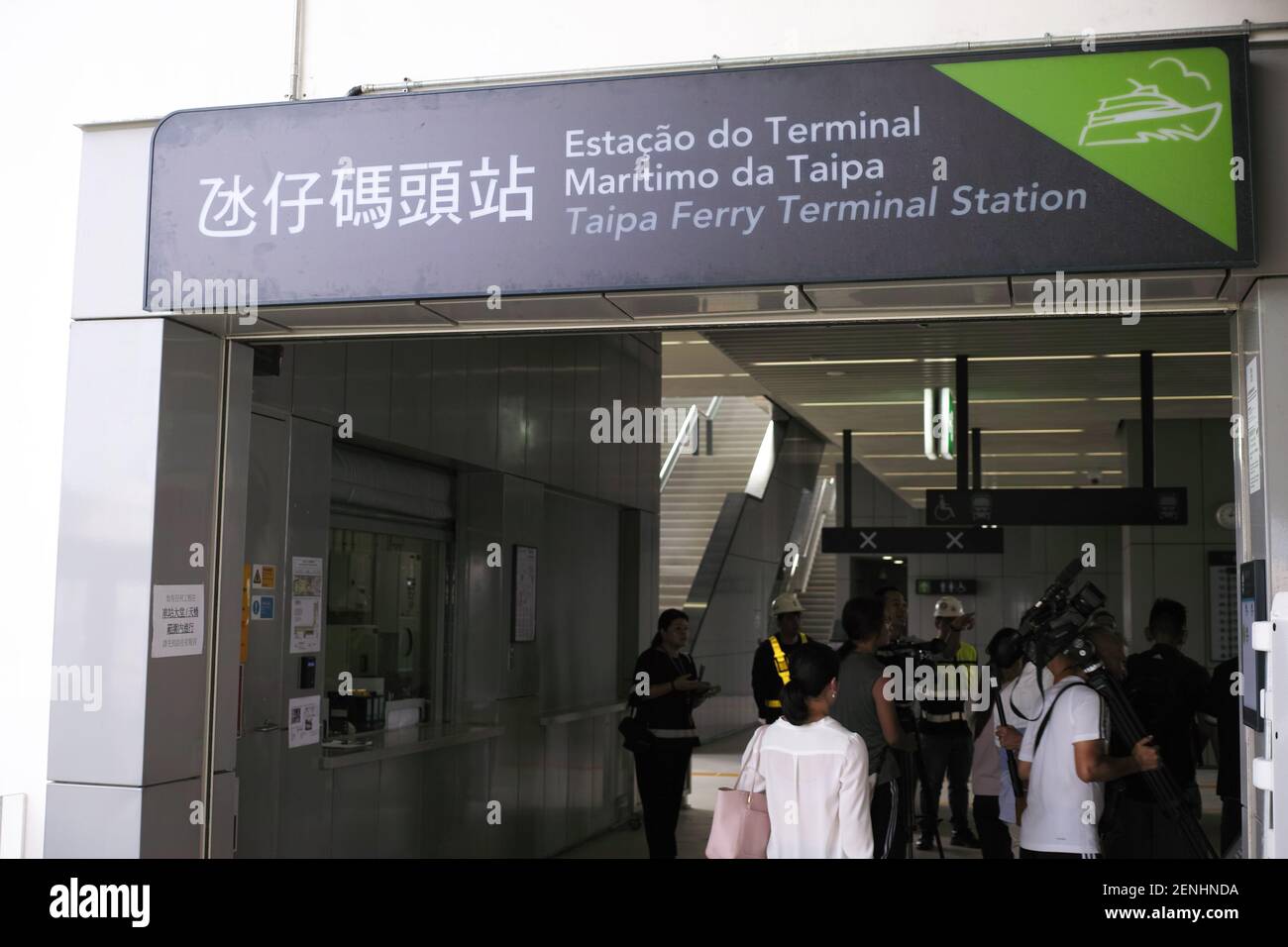 Chinese workers introduce the Light Rail Transit (LRT) system at the ...