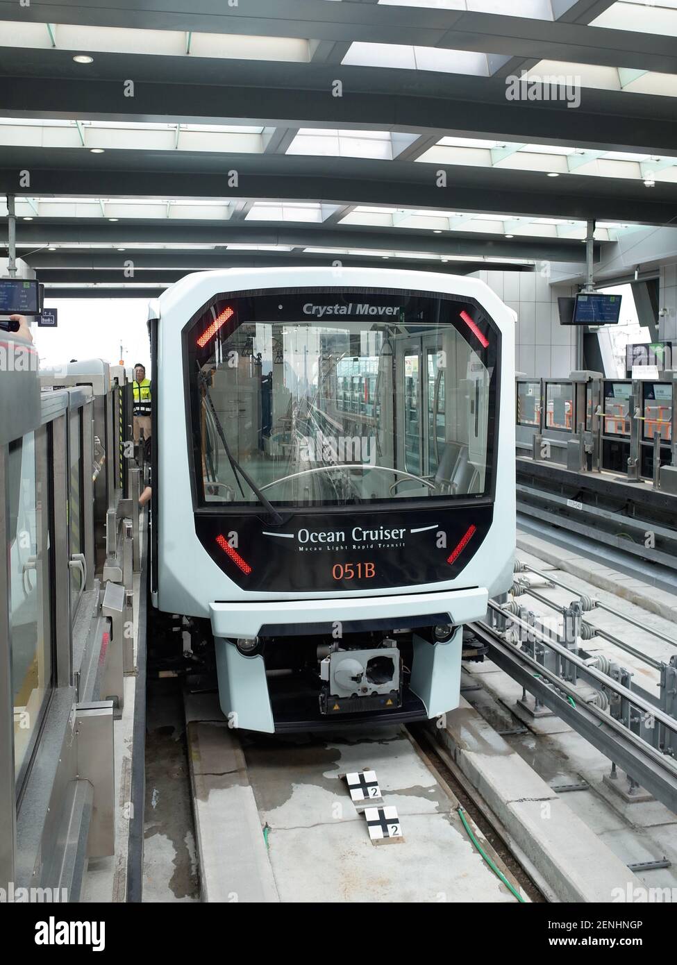Chinese workers introduce the Light Rail Transit (LRT) system at the ...