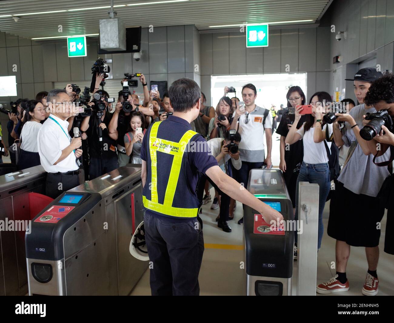 Chinese workers introduce the Light Rail Transit (LRT) system at the ...