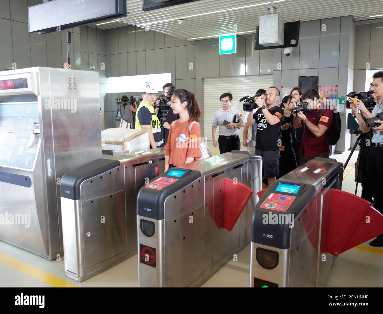 Chinese workers introduce the Light Rail Transit (LRT) system at the ...