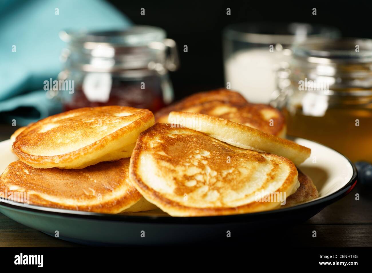 Blini served with strawberry jam, honey, sour cream and fresh berries ...