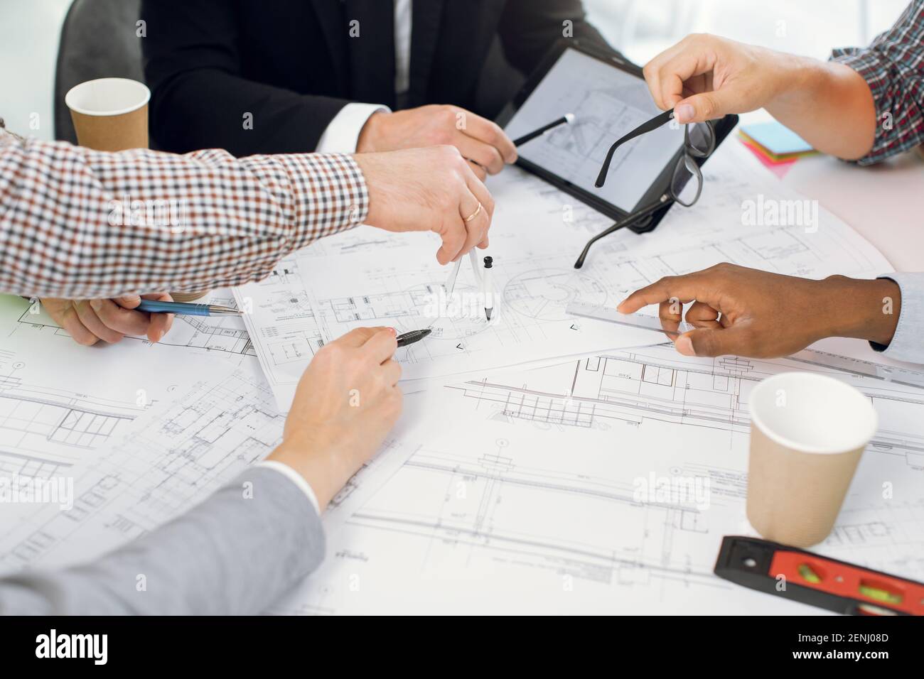 Close up of people hands drawing project of new building Stock Photo ...