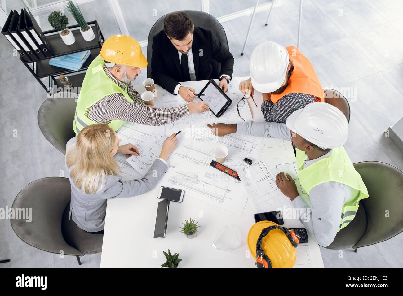 Construction team planning arrangement of service lines Stock Photo - Alamy