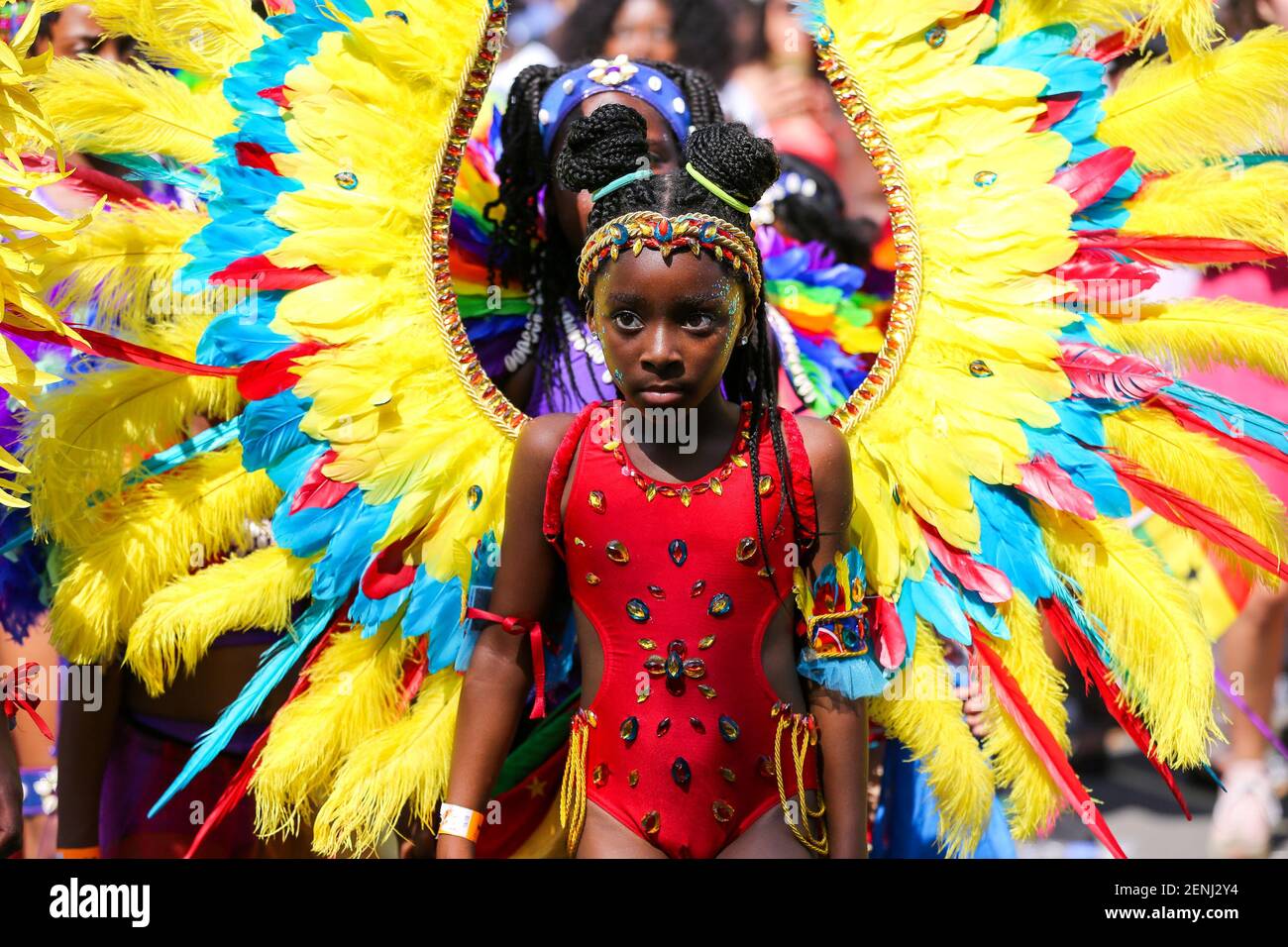 Kid dancer in a costume during the children parade on the family day of ...