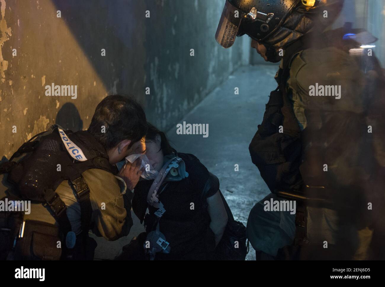 Riot police officers arrest a protester during the clashes. Hundreds of ...