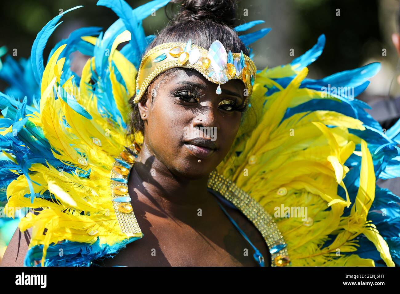 A performer wearing a colourful costume during the Children's Parade on ...