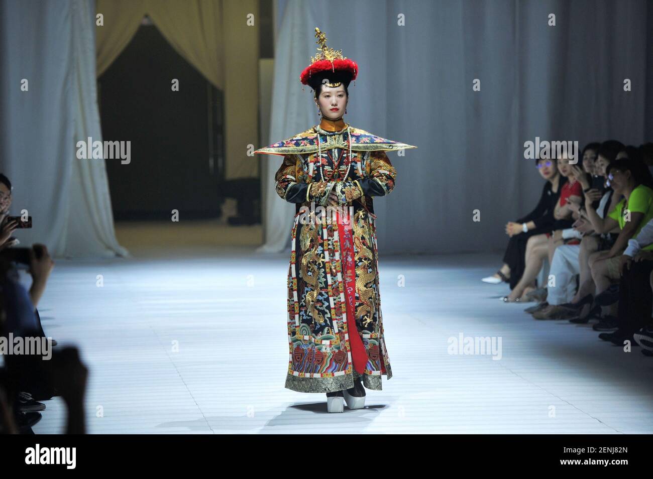 A model displays a costume featuring Chinese elements during a film ...