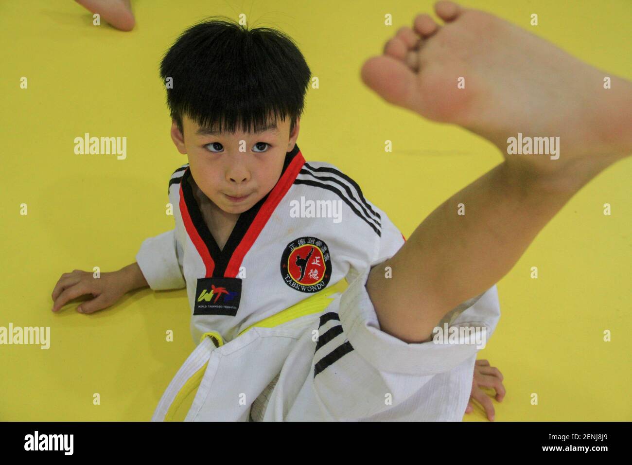 A young Chinese boy practises taekwondo during a training session at a ...