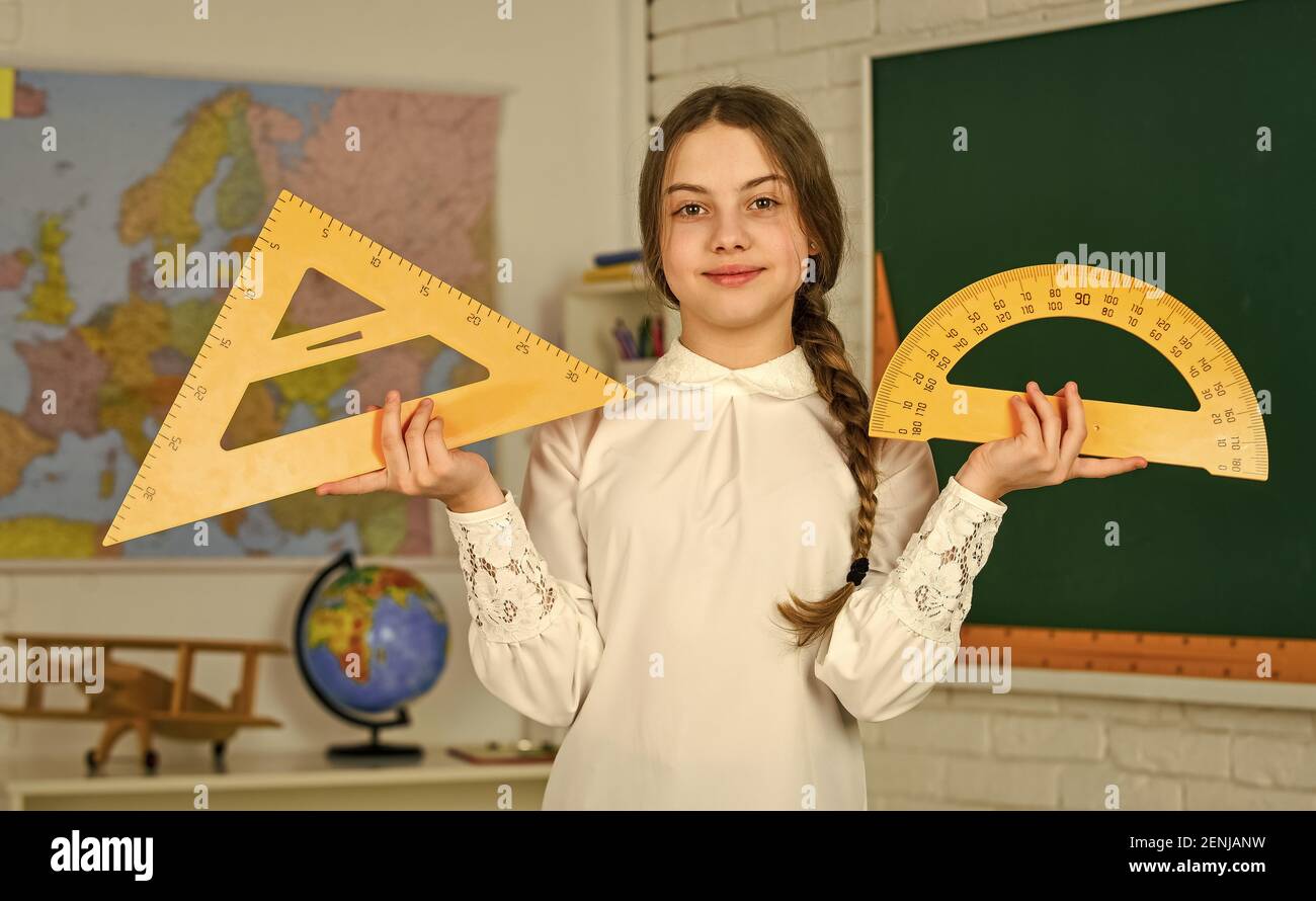 Geometry favorite subject. measure angles in degrees. Small child girl ...