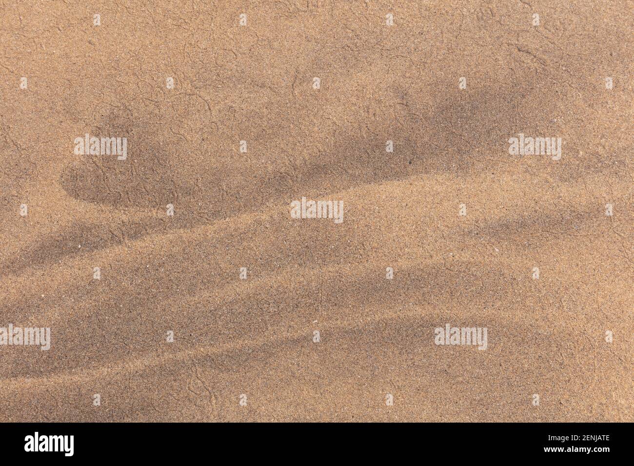 Close up abstract image of golden sand at a beach with beautiful ...