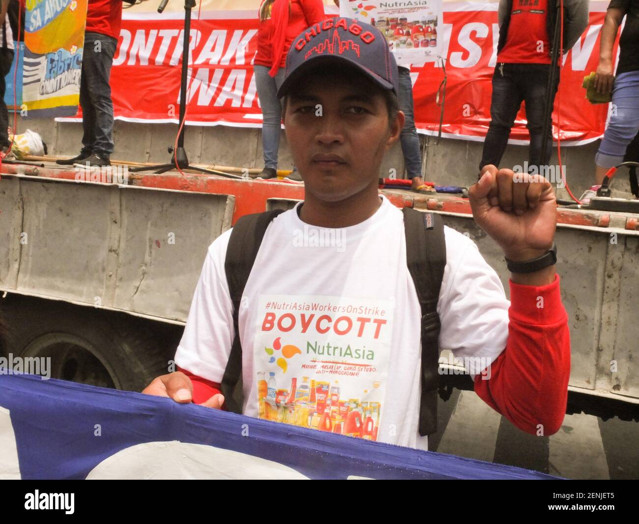 A protester raises his fist during the demonstration. Thousands of ...