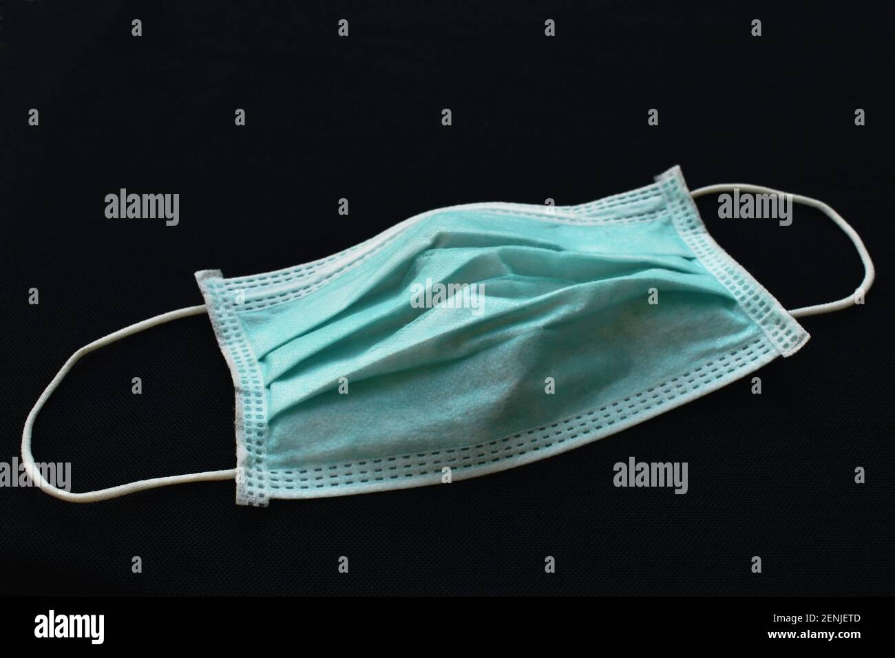 hygienic mask for protection nose and mouth arranging on black fabric ...