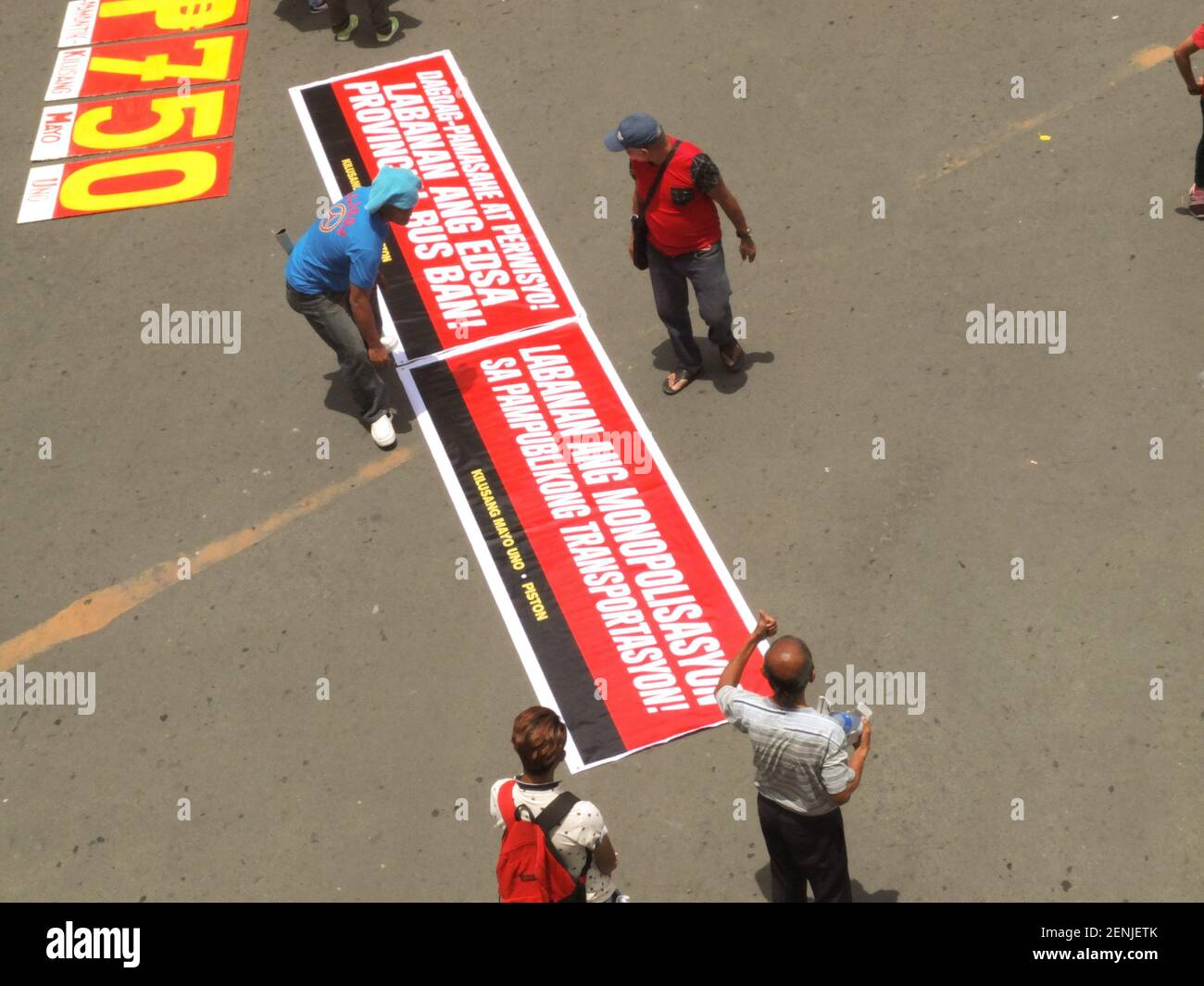 Protesters lay banners in the streets of Mendiola, during the ...