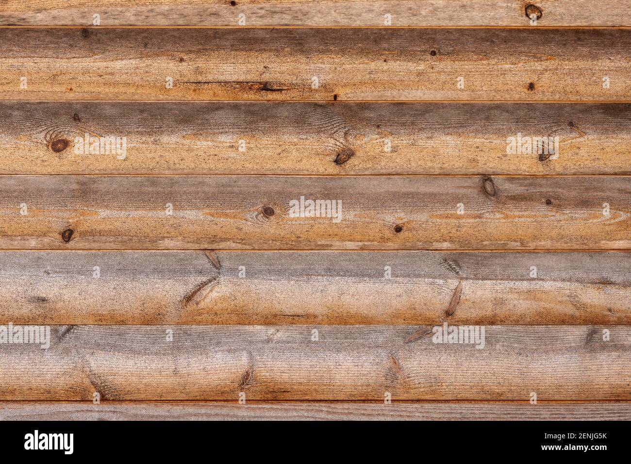 Wooden wall made of logs, background photo texture Stock Photo - Alamy