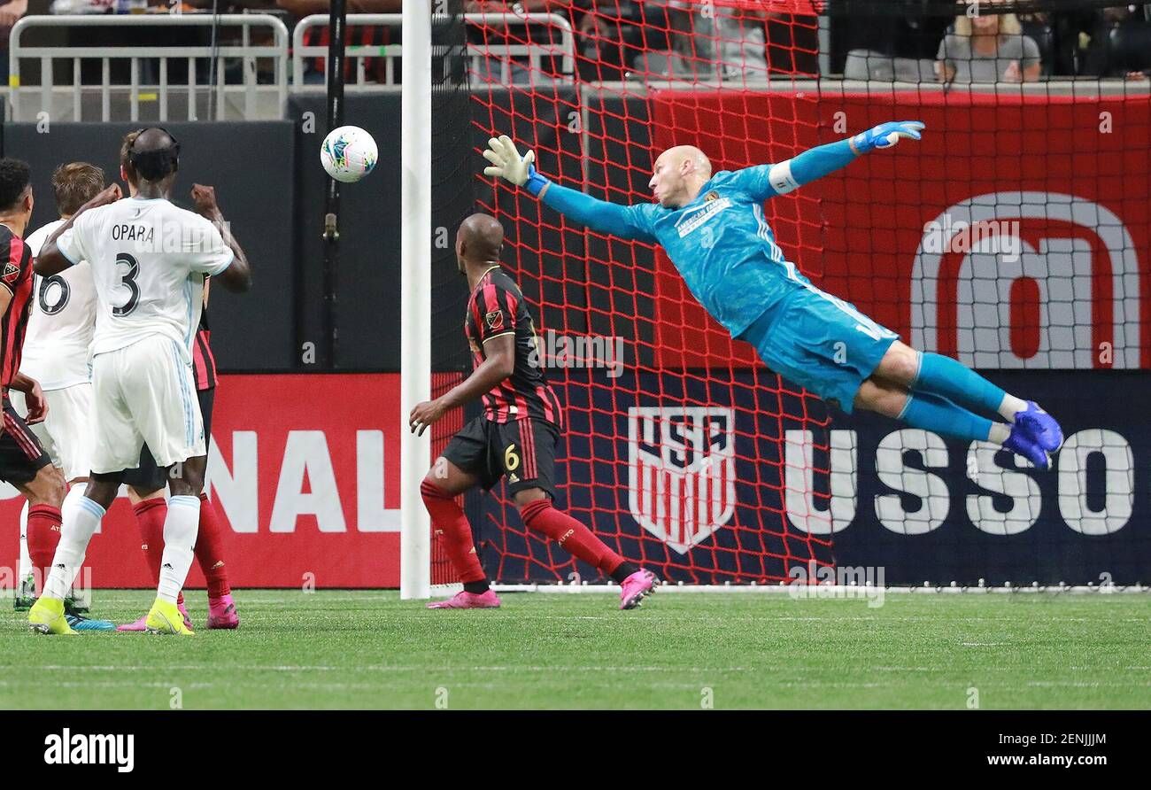 Atlanta United goalkeeper Brad Guzan defends a shot by Minnesota United ...