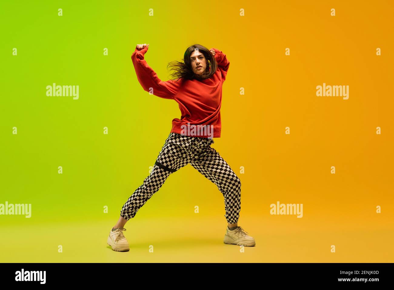 Freedom. Stylish sportive girl dancing hip-hop in stylish clothes on ...