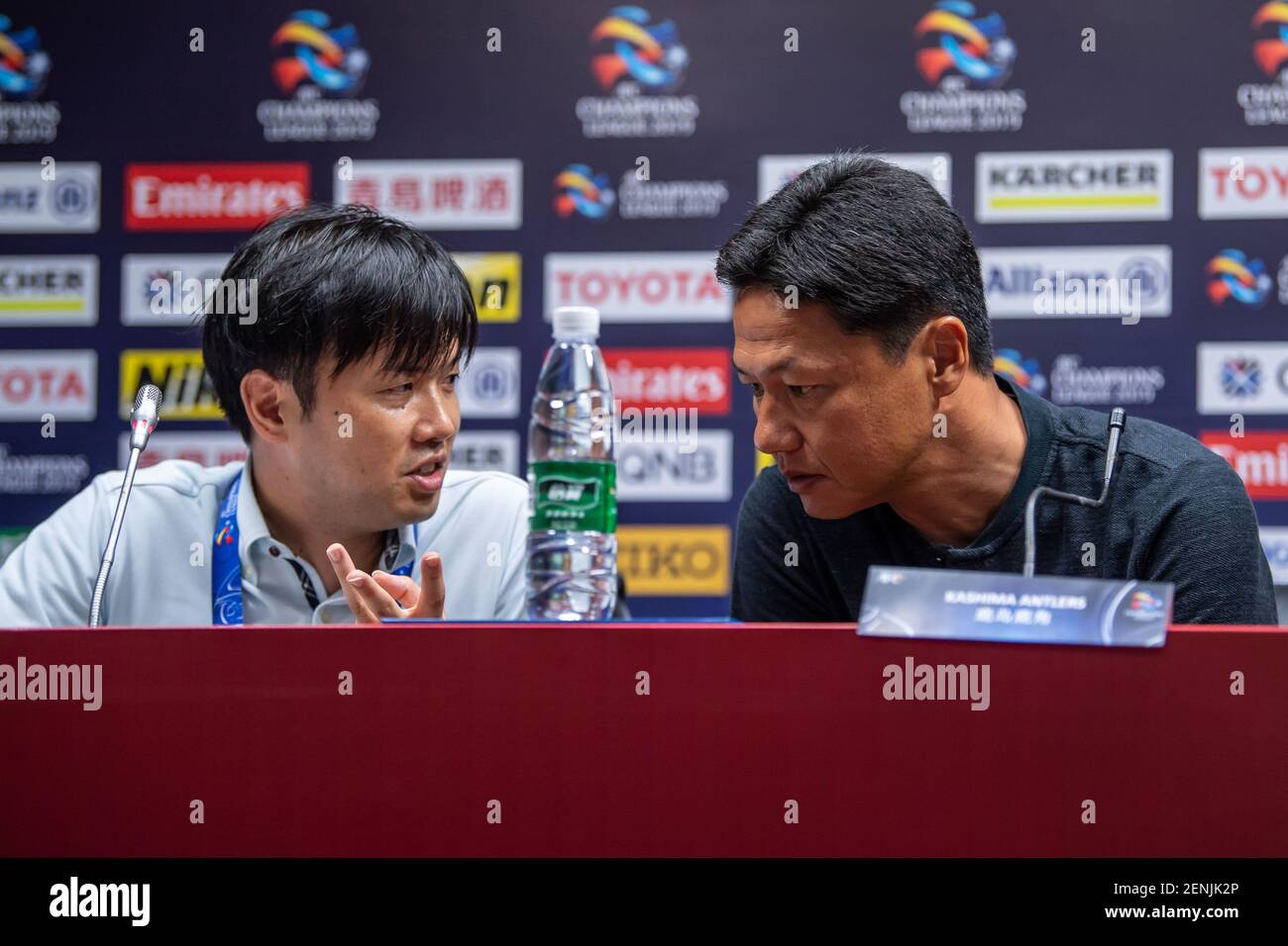 Head coach Go Oiwa, right, of Japan's Kashima Antlers F.C. attends a ...