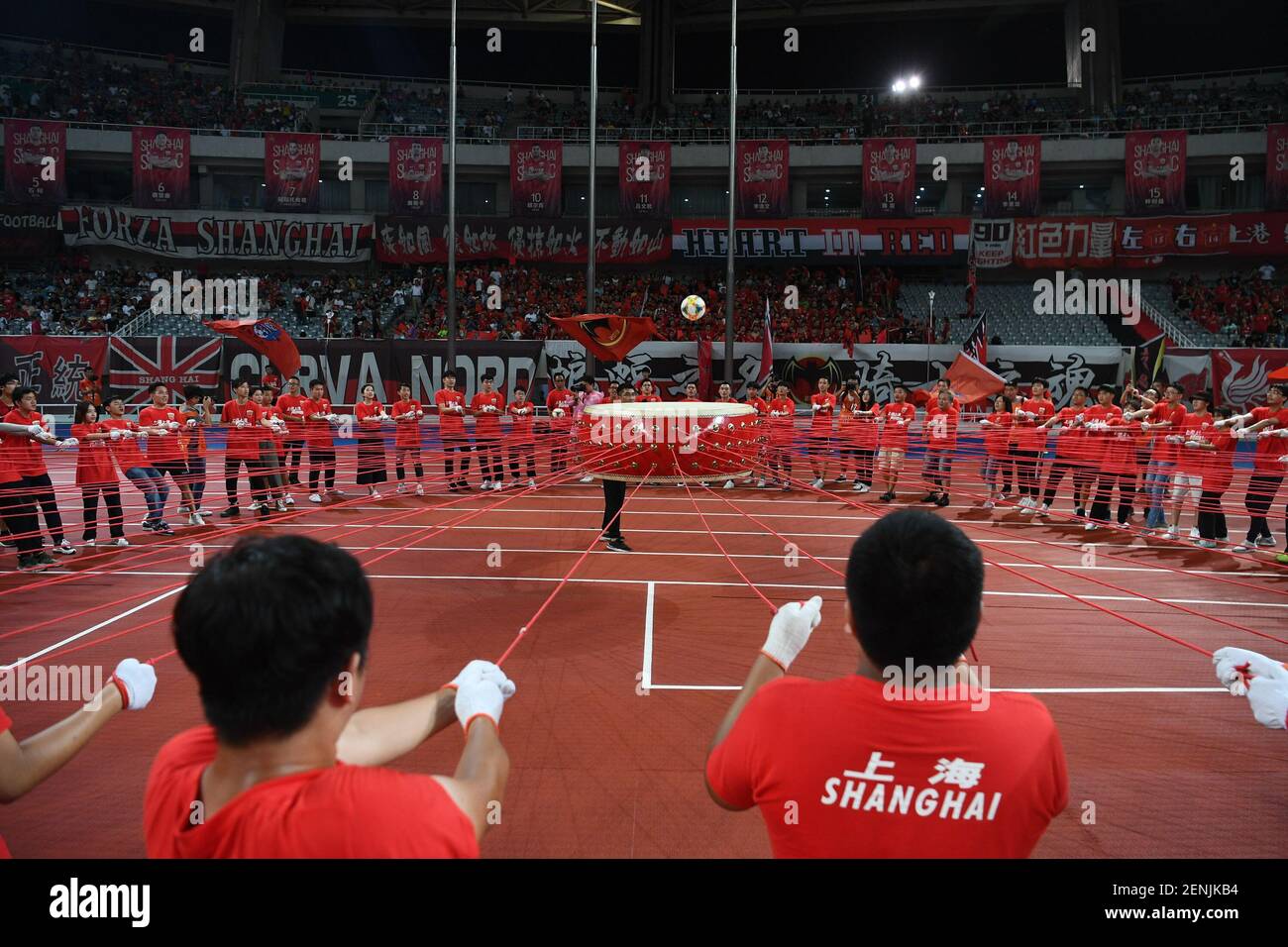 Chinese fans cheer for Shanghai SIPG F.C. with a drum at the Shanghai ...
