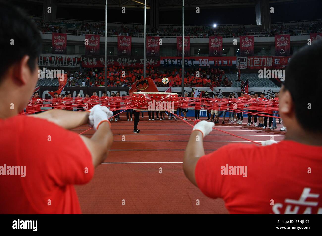 Chinese fans cheer for Shanghai SIPG F.C. with a drum at the Shanghai ...