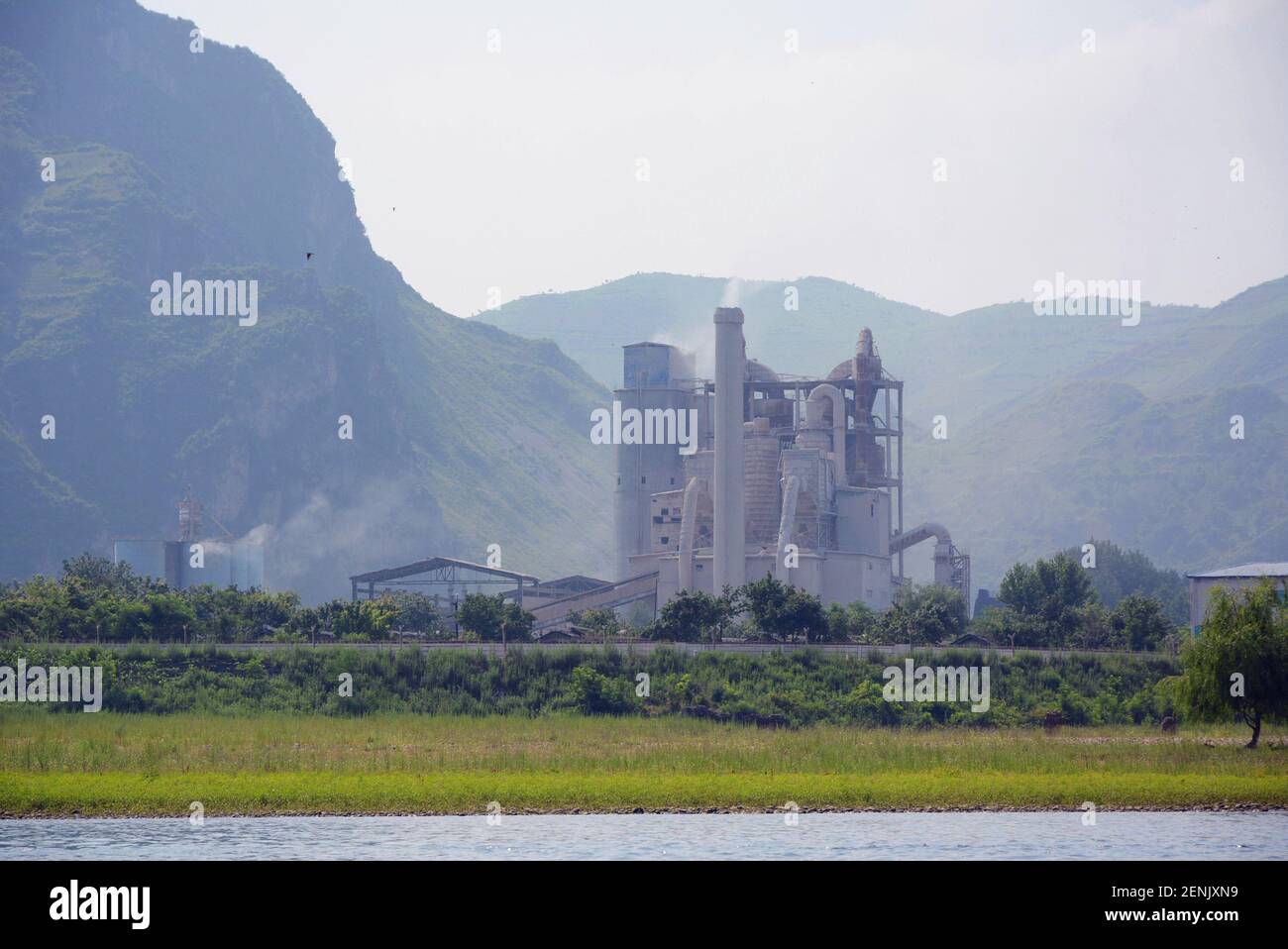 View of a cement plant in North Korea from Yangyutou ferry in Ji'an ...
