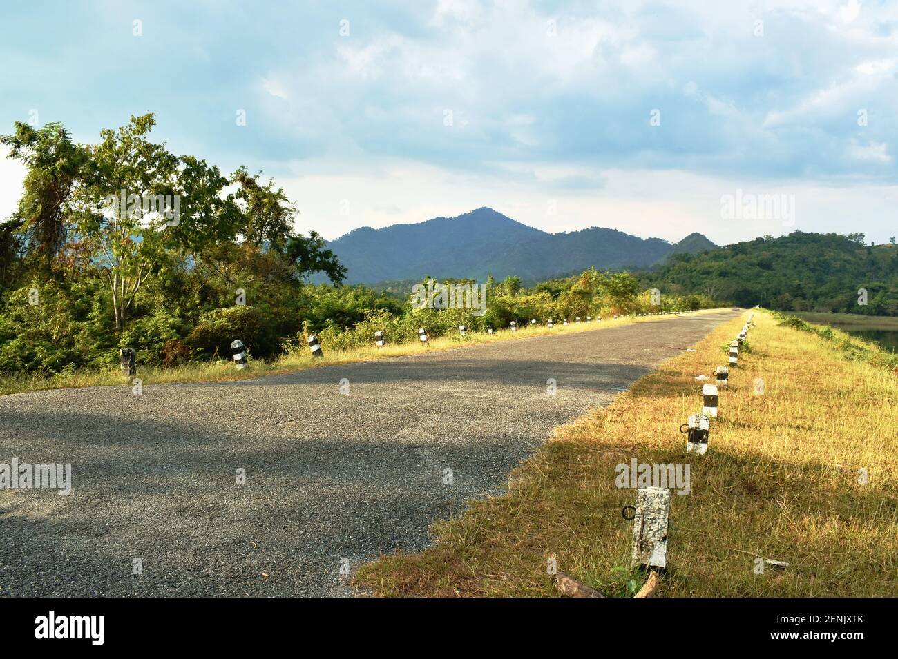 road on water reservoir lake with mountain background Stock Photo - Alamy
