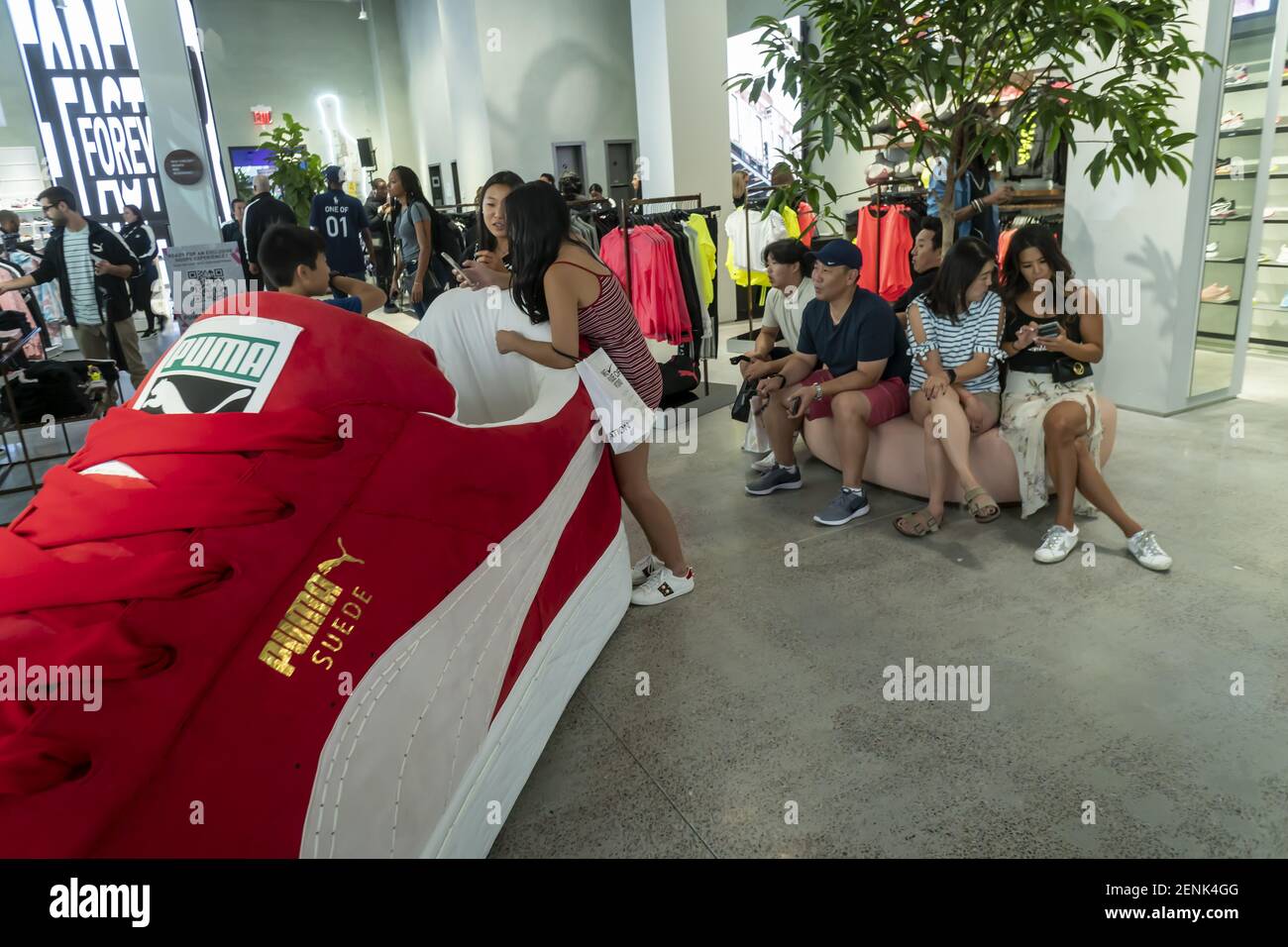 Shoppers and visitors flock to the newly opened Puma flagship store on ...