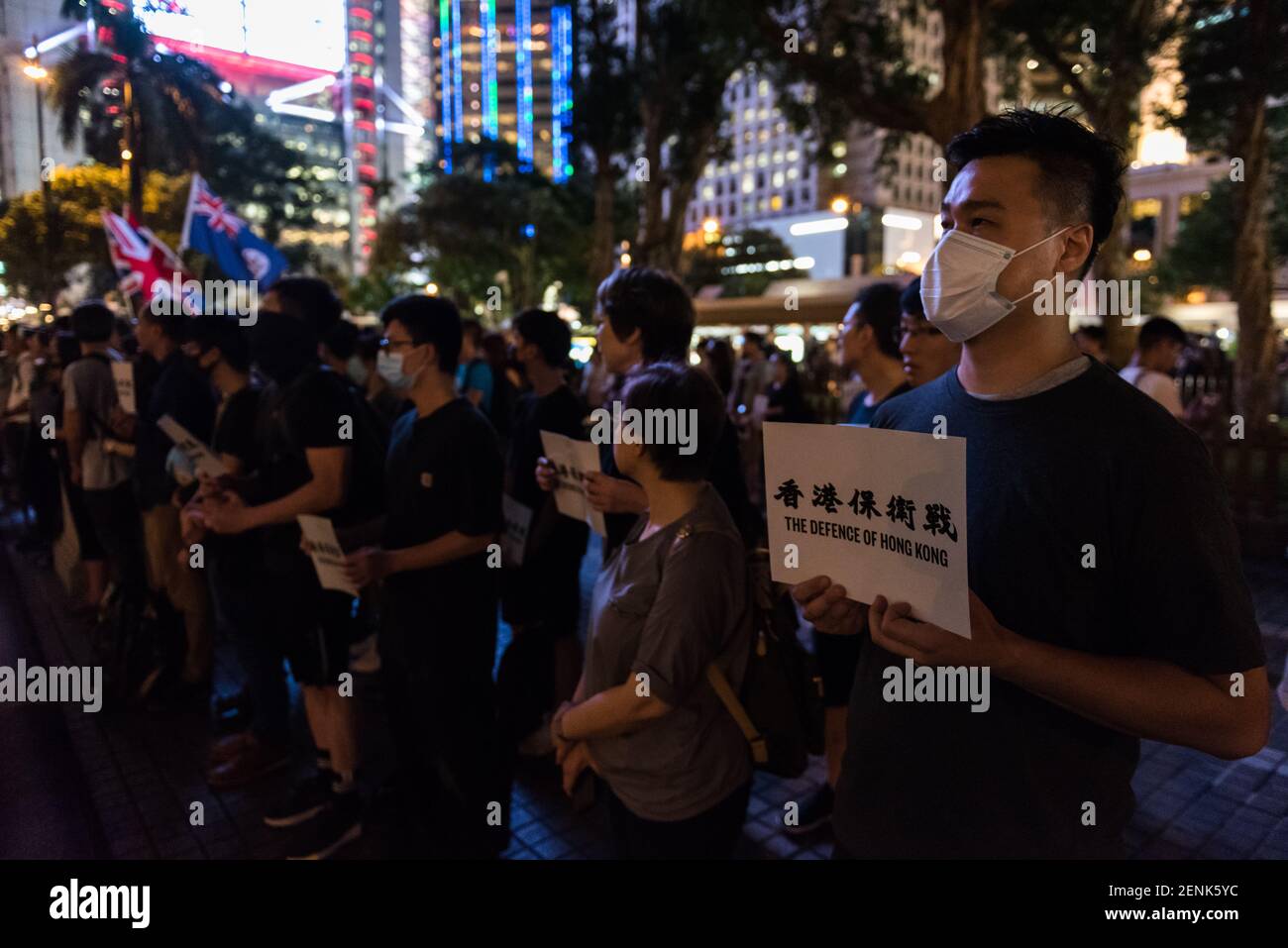 A protester holds a placard supporting Hong Kong and the anti ...