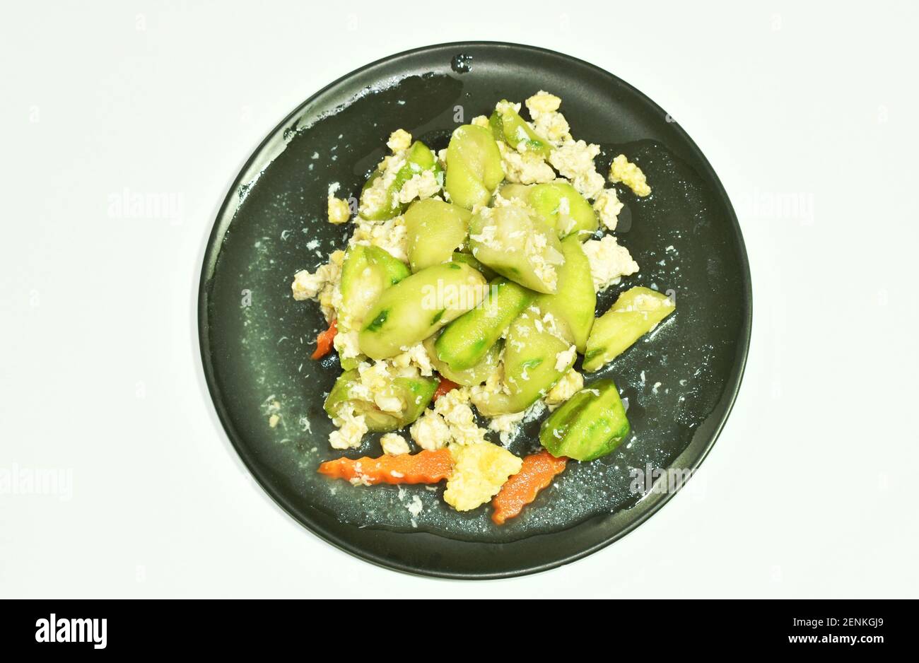 Stir fried ridge gourd with egg and pork on dish Stock Photo - Alamy