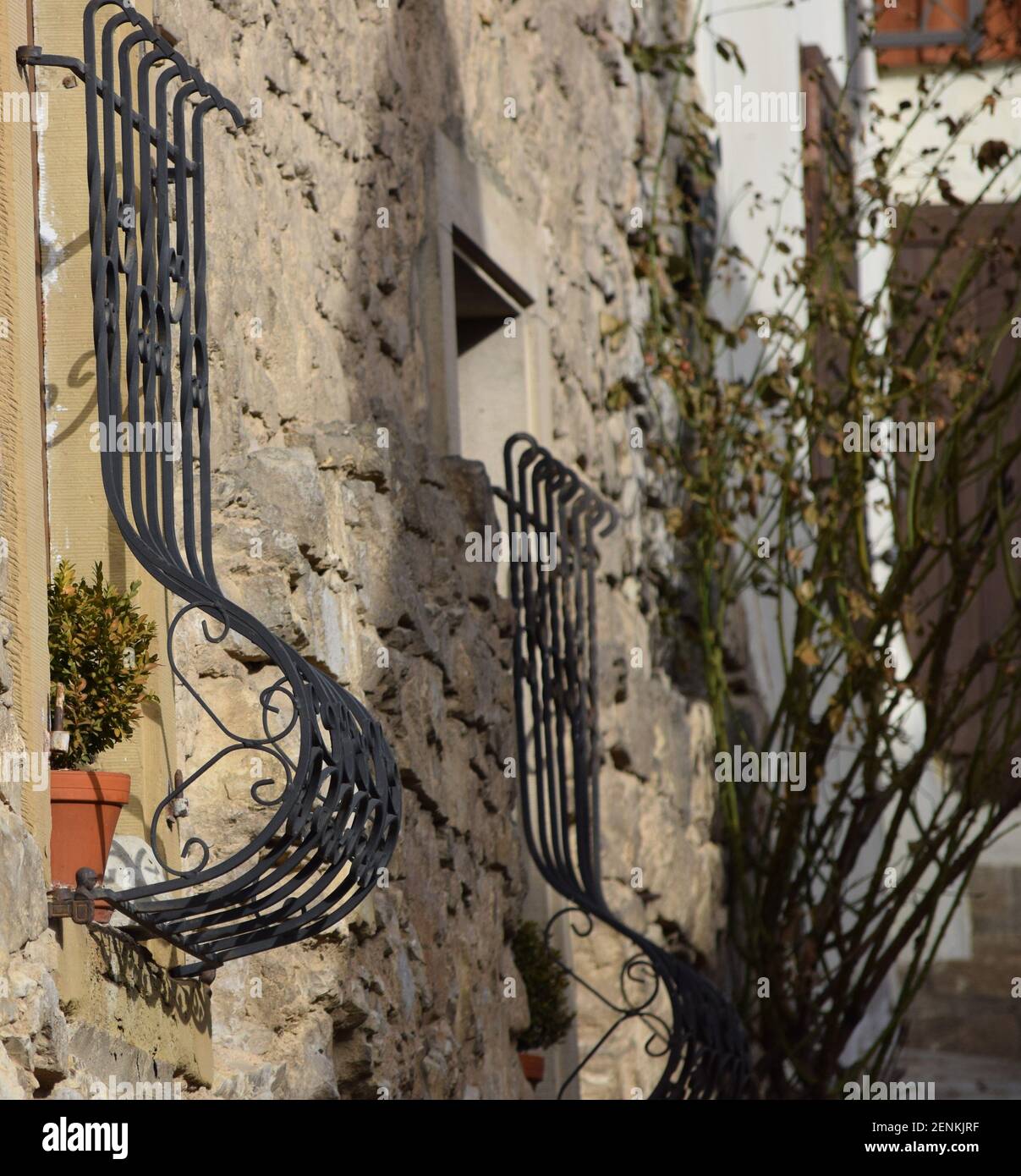 Arched window grilles in the Tuscan style Stock Photo - Alamy
