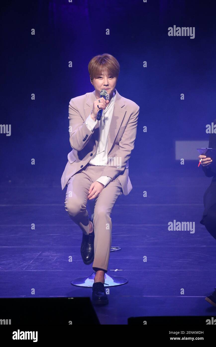 South Korean singer Shin Hye-sung of Korean boy group Shinhwa interacts ...