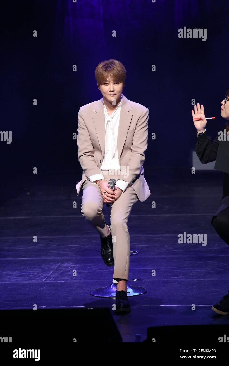 South Korean singer Shin Hye-sung of Korean boy group Shinhwa interacts ...